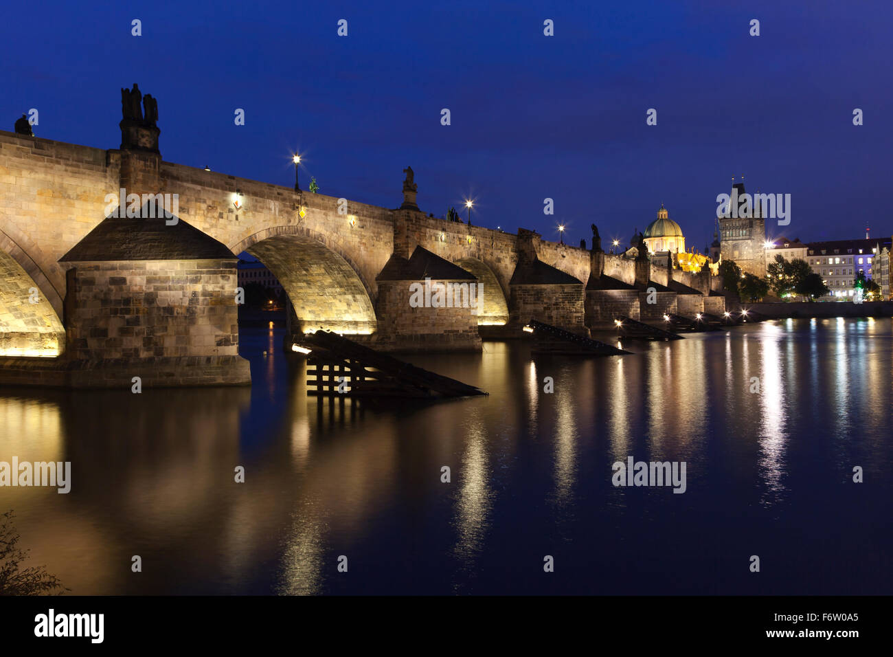 Czechia, Prague, view to lighted Charles Bridge and Old Town Bridge ...
