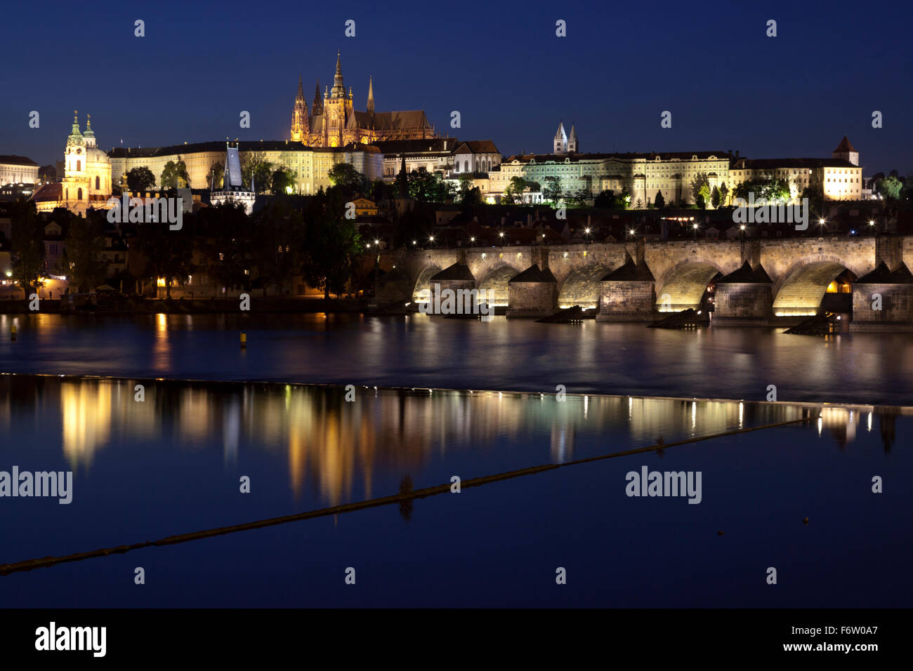 Czechia, Prague, view to lighted Prague Castle and Charles Bridge at ...
