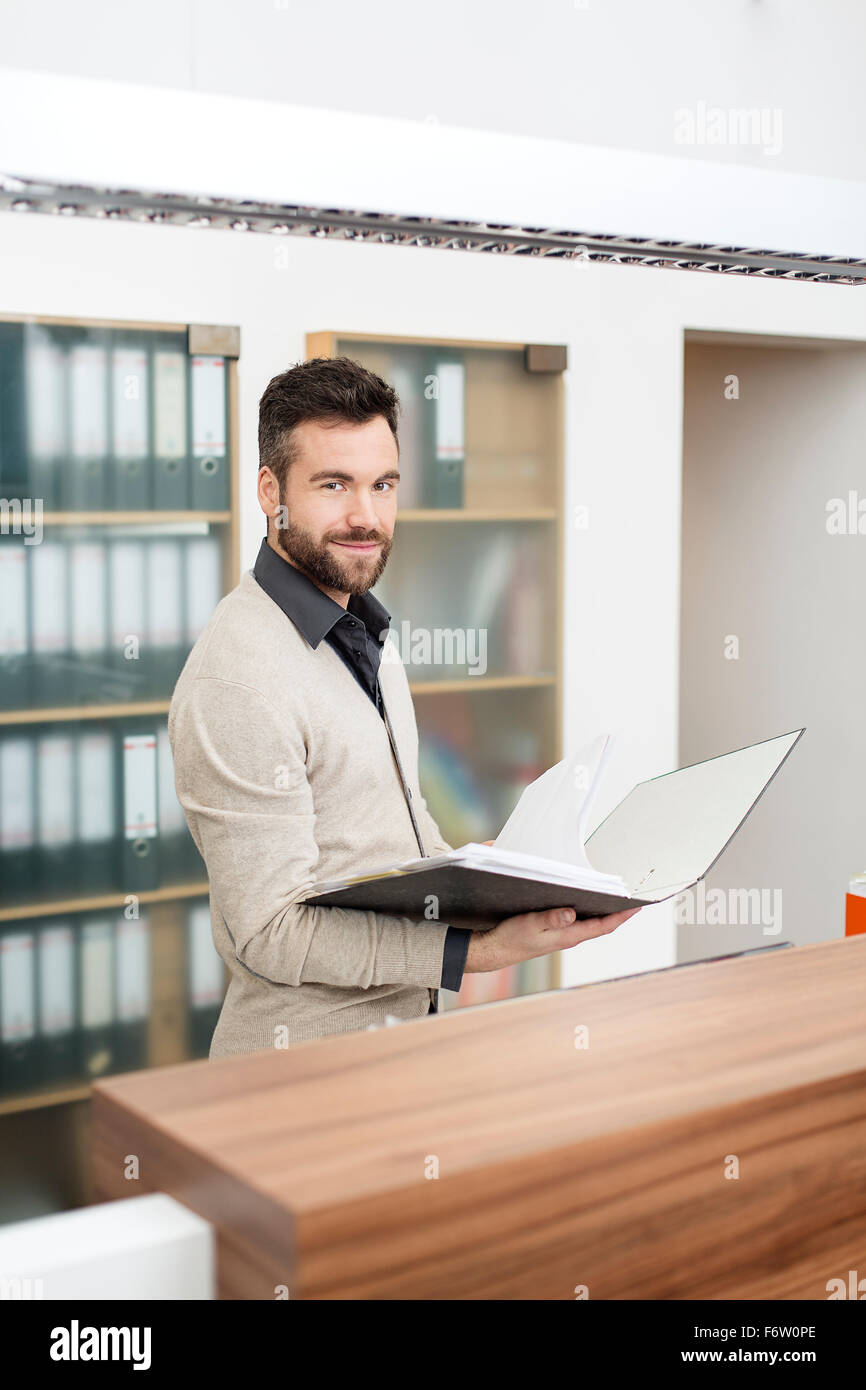 Man at file cabinet hi-res stock photography and images - Alamy