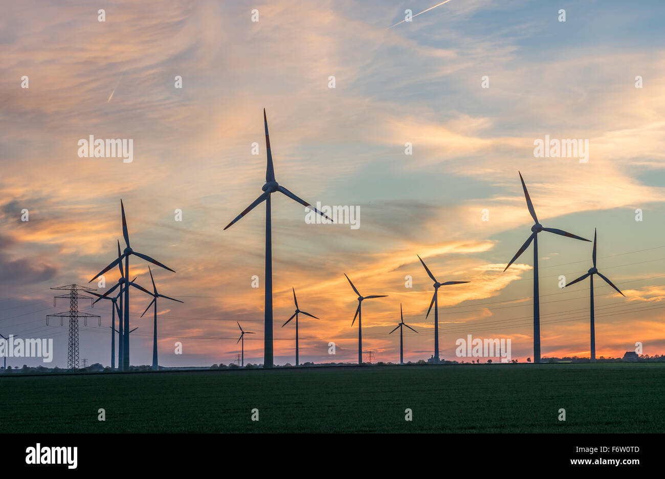 Wind farm at sunset Stock Photo - Alamy