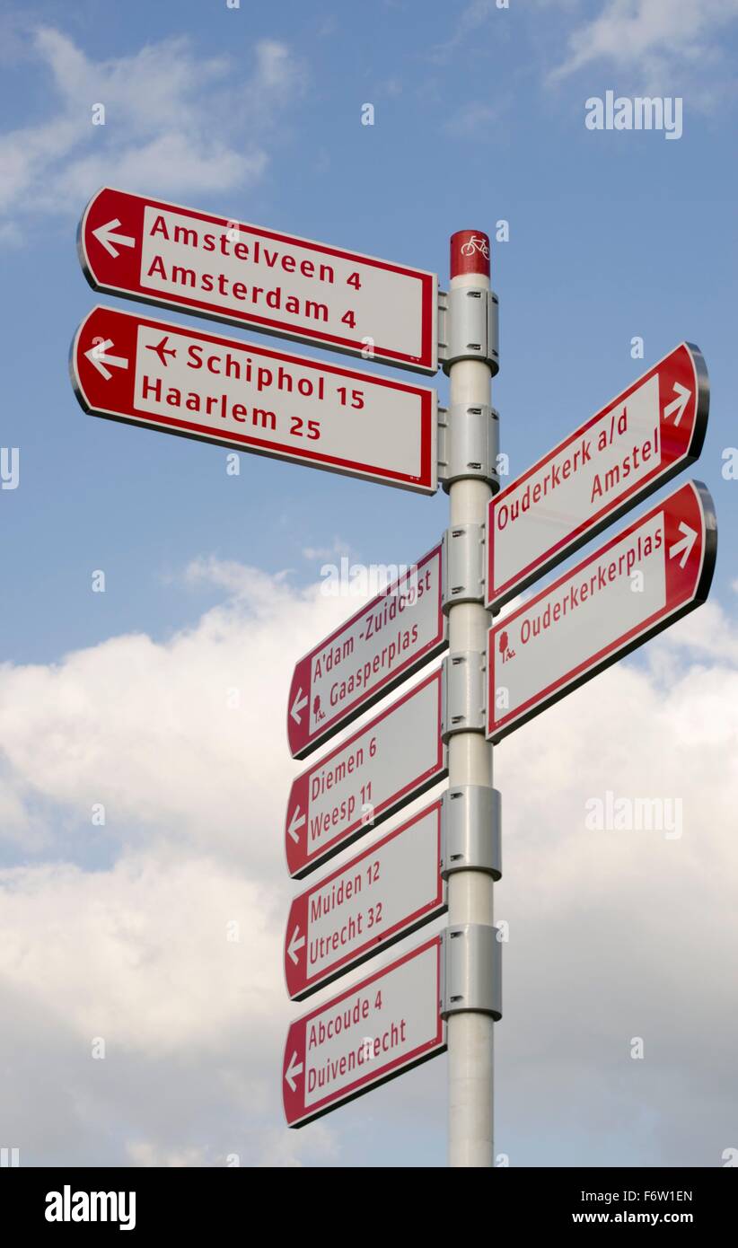 Bicycle paths guide. White sign with city names, The Netherlands Stock ...