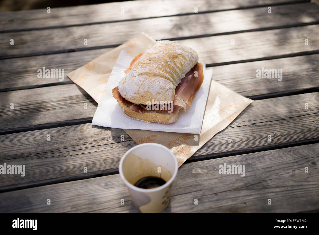 Ciabatta with Parma ham on wooden table outdoors Stock Photo - Alamy