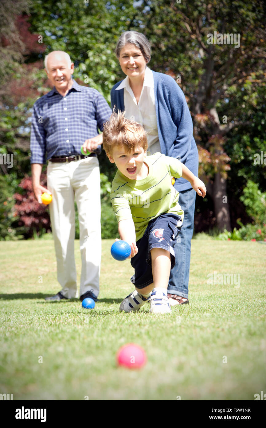 Little boy playing boccia with his grandparents Stock Photo - Alamy