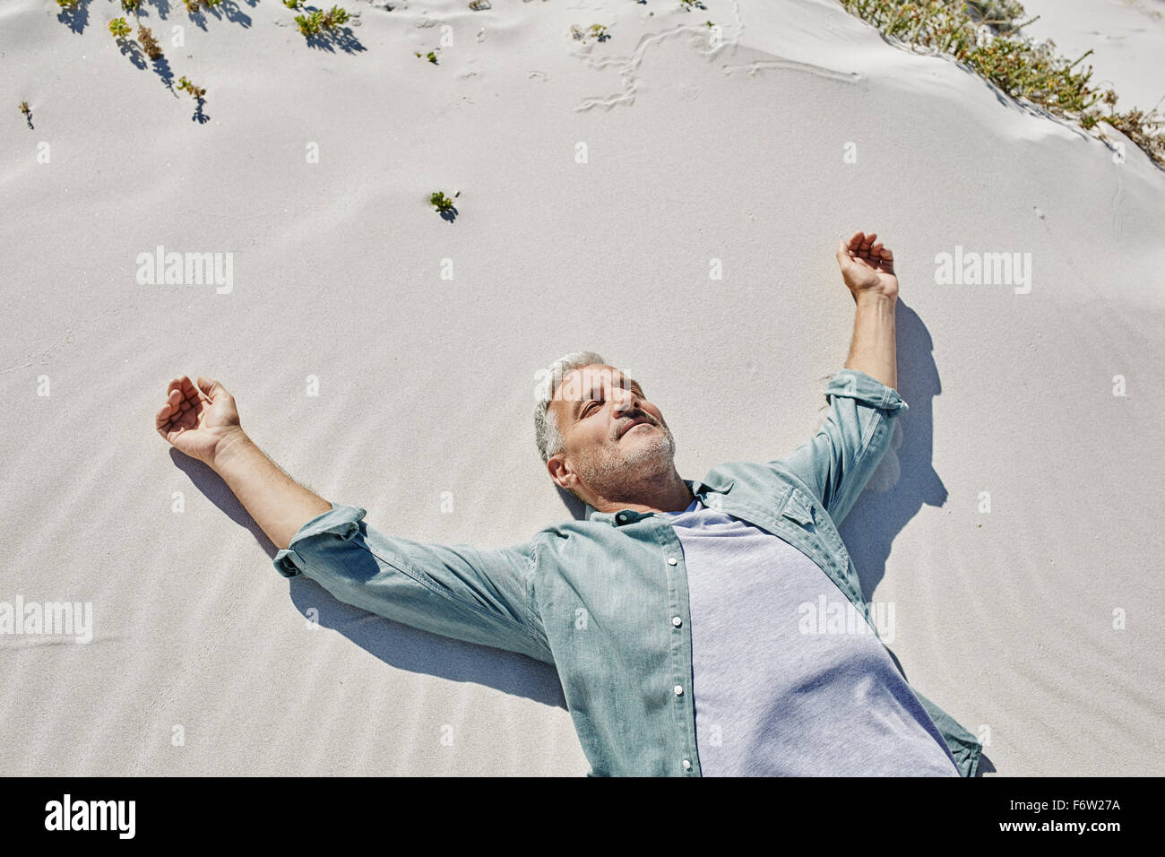 Best ager man at the beach Stock Photo - Alamy