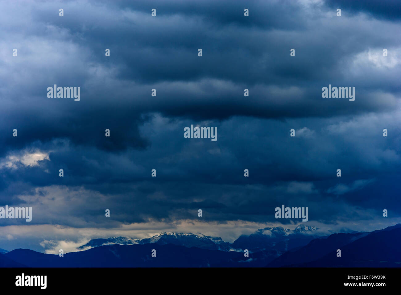 Germany, Bavaria, View of Bavarian Alps with rain clouds Stock Photo ...