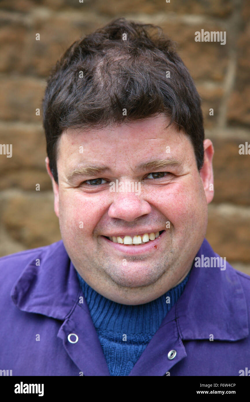 Portrait of man with learning disability smiling; at Brook Farm; Linby ...