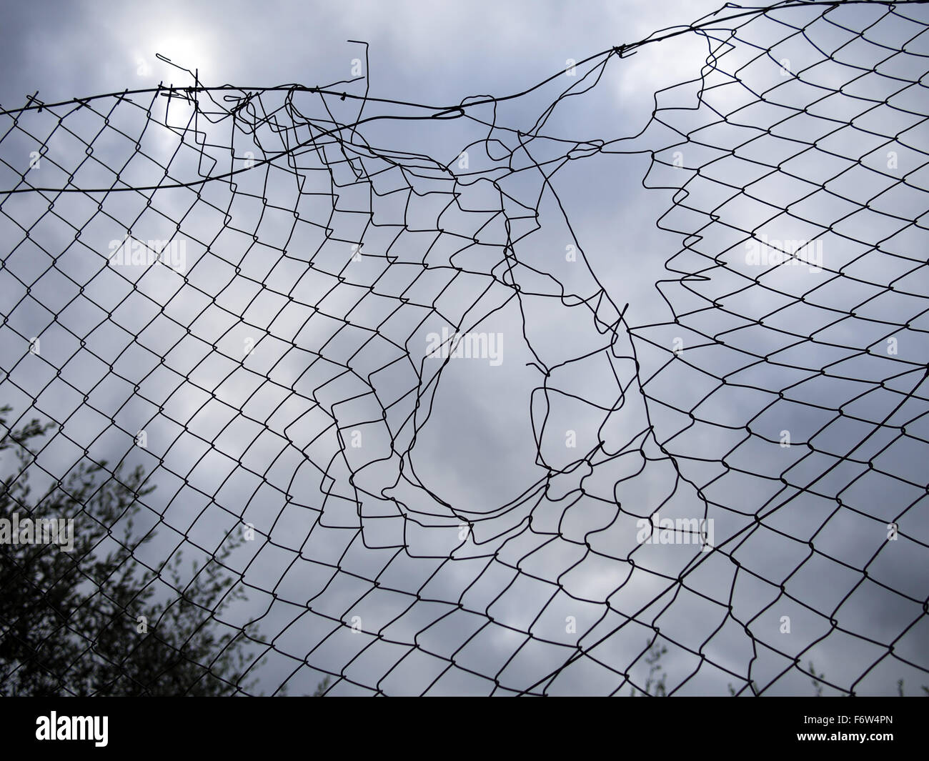 Torn hole in wire mesh hi-res stock photography and images - Alamy