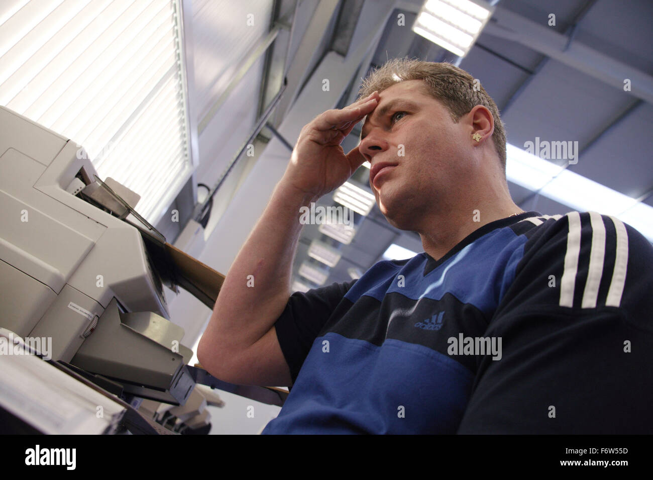 Man with epilepsy working as scanning operator in direct marketing ...