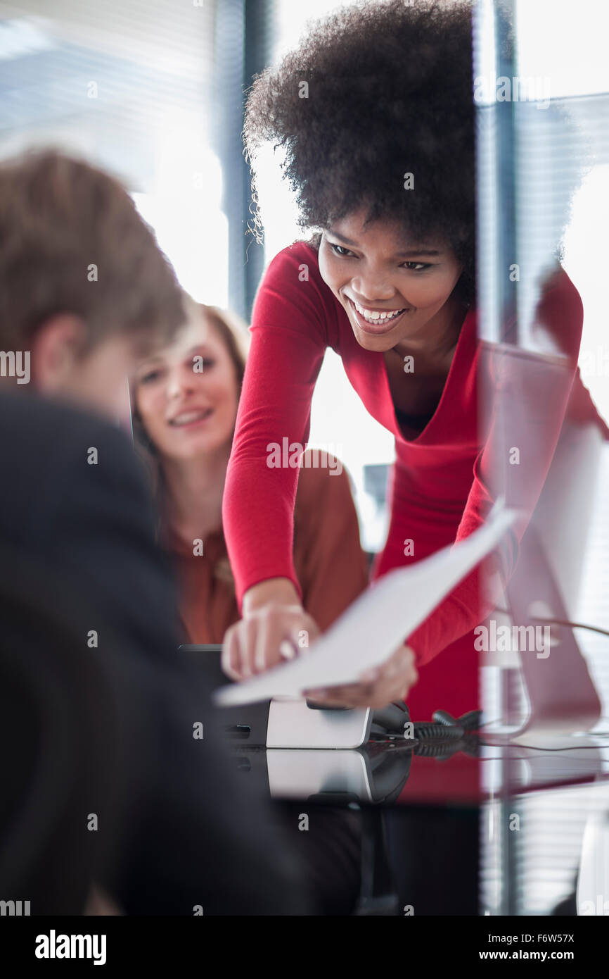 Three colleagues talking in office Stock Photo - Alamy