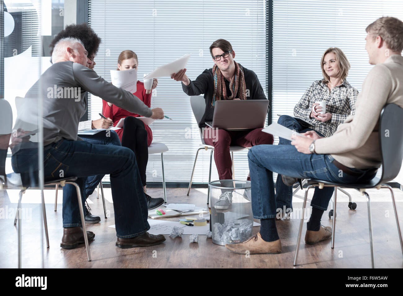 Colleagues in office having an informal meeting Stock Photo - Alamy