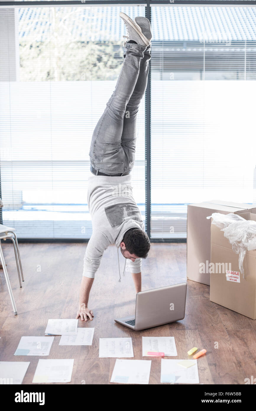 Office worker handstand hi-res stock photography and images - Alamy