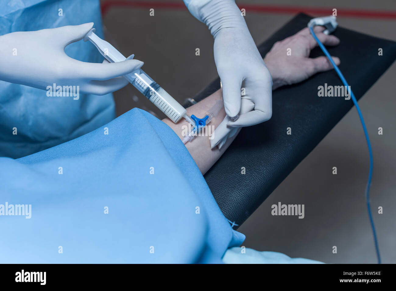Patient in operating room receiving medication Stock Photo - Alamy