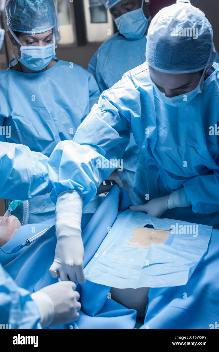 Surgical team preparing patient for operation Stock Photo - Alamy
