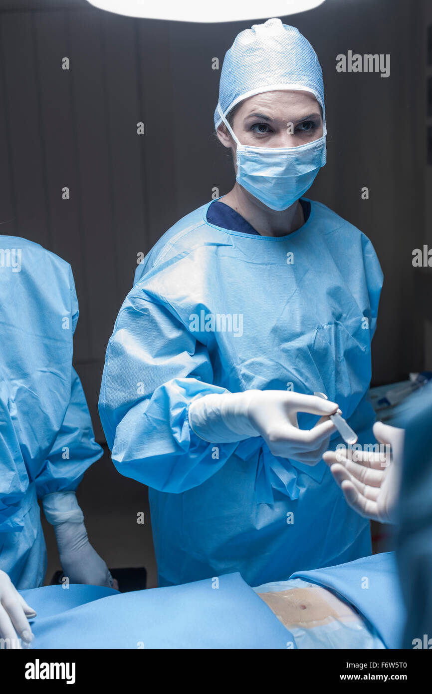 Surgical team preparing patient for operation Stock Photo - Alamy