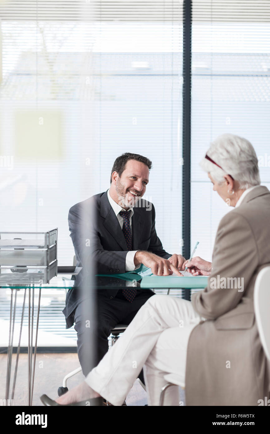 Businessman and secretary in office Stock Photo - Alamy