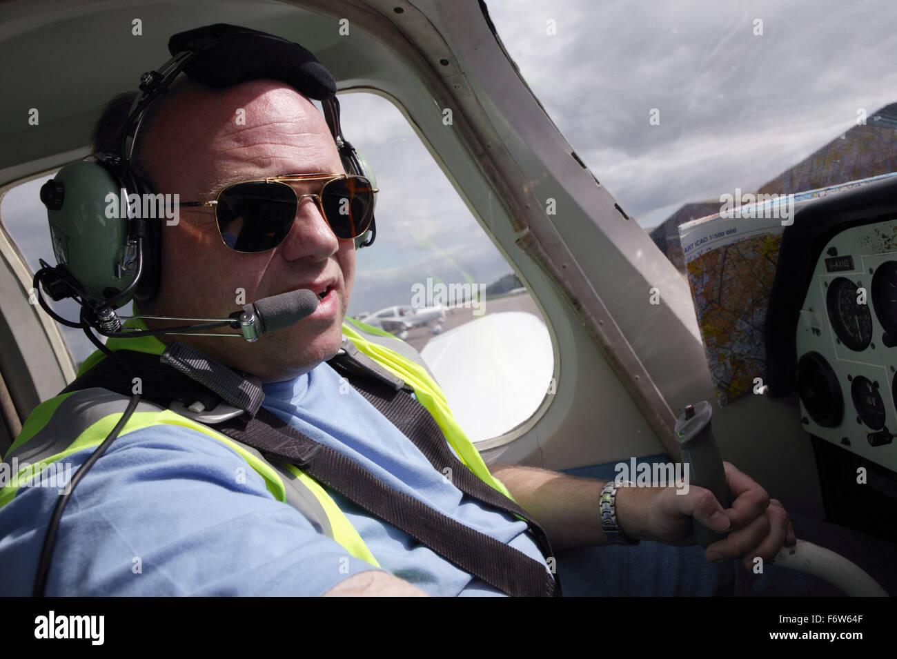 Man with disability; who is wheelchair user; sitting in aircraft ...