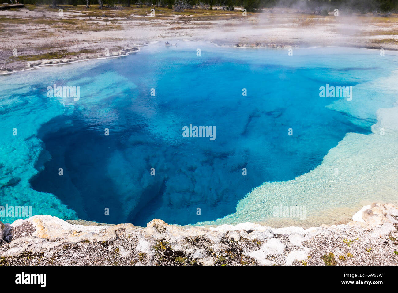 Deep blue wonderful pool in Yellowstone Stock Photo - Alamy