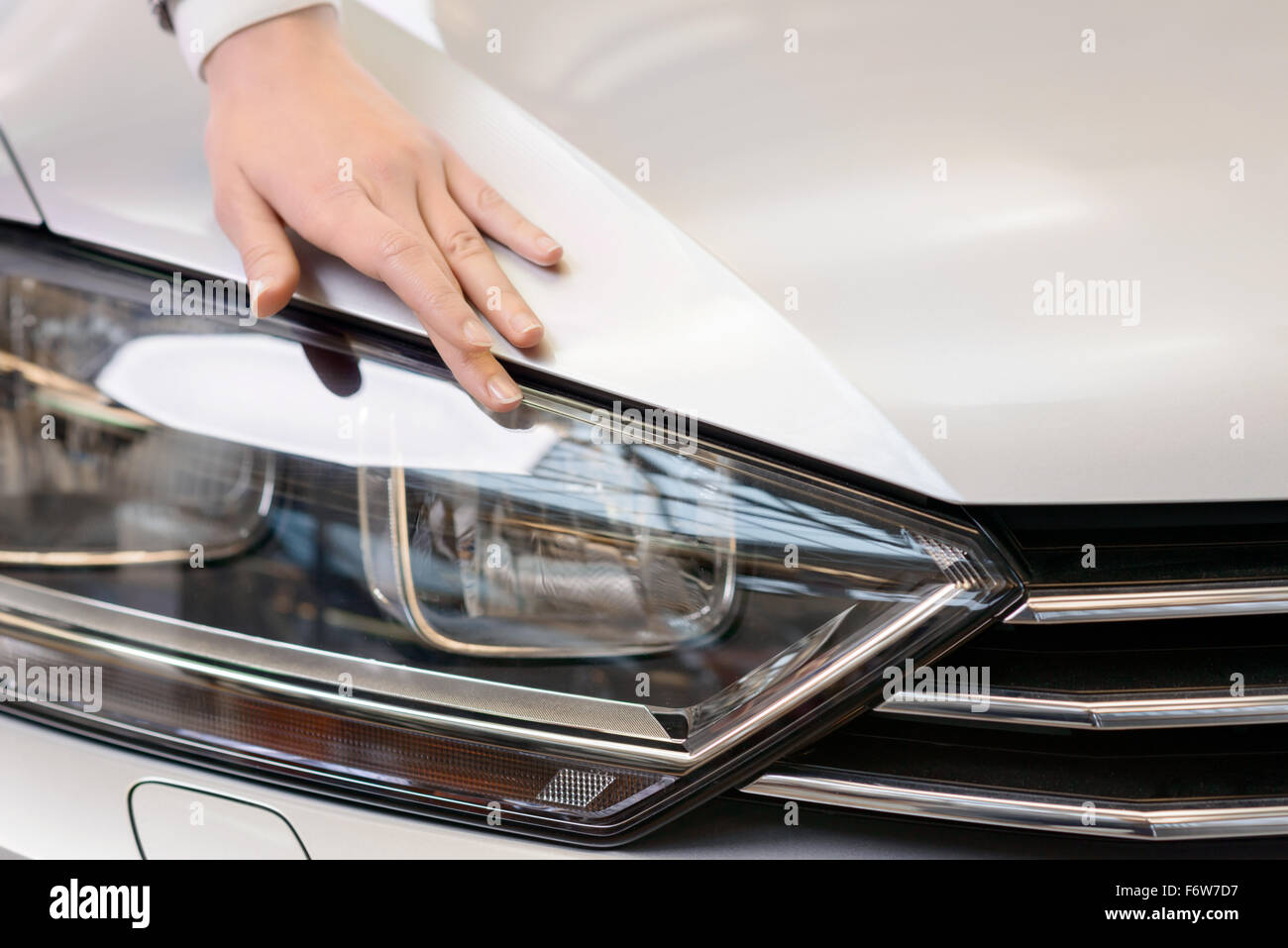 Hand checking the car surface Stock Photo - Alamy
