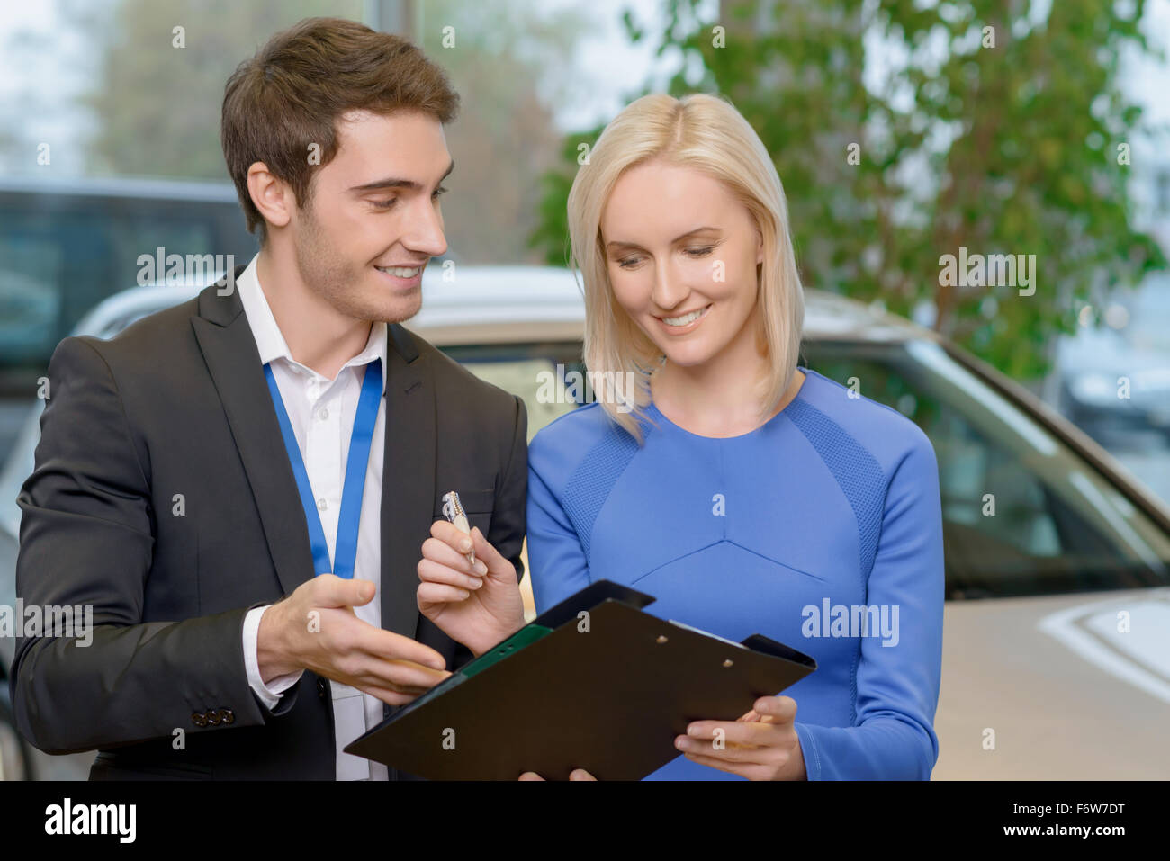 Salesperson communicating with customer Stock Photo - Alamy