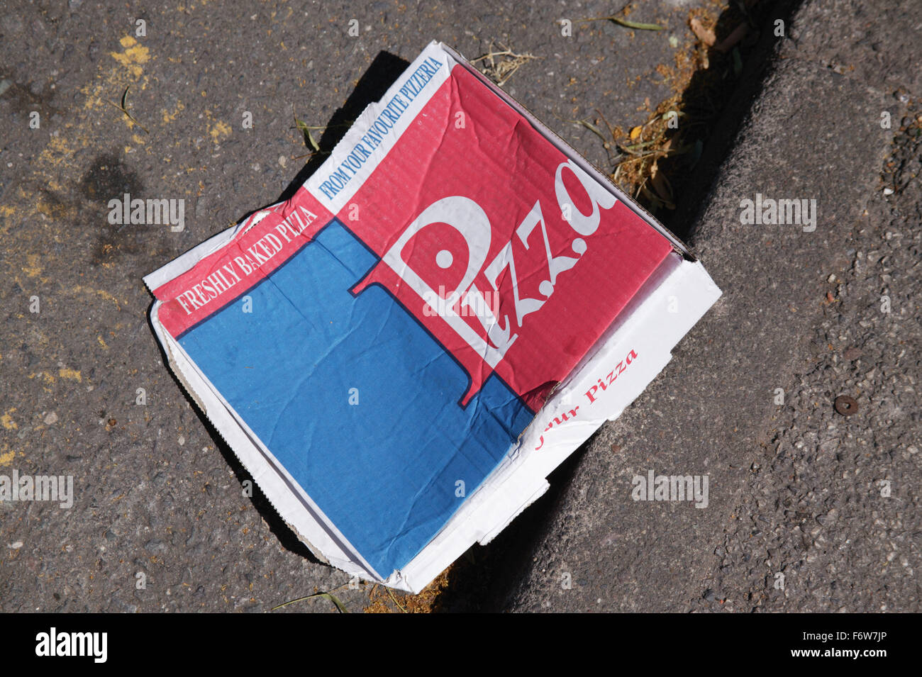 Pizza box dropped on the street Stock Photo - Alamy