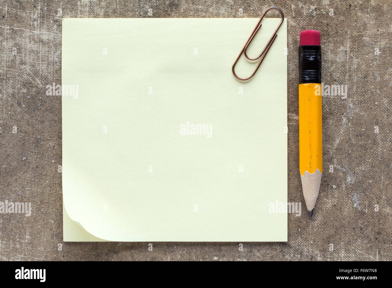 Sticky note paper with paperclip and pencil Stock Photo - Alamy