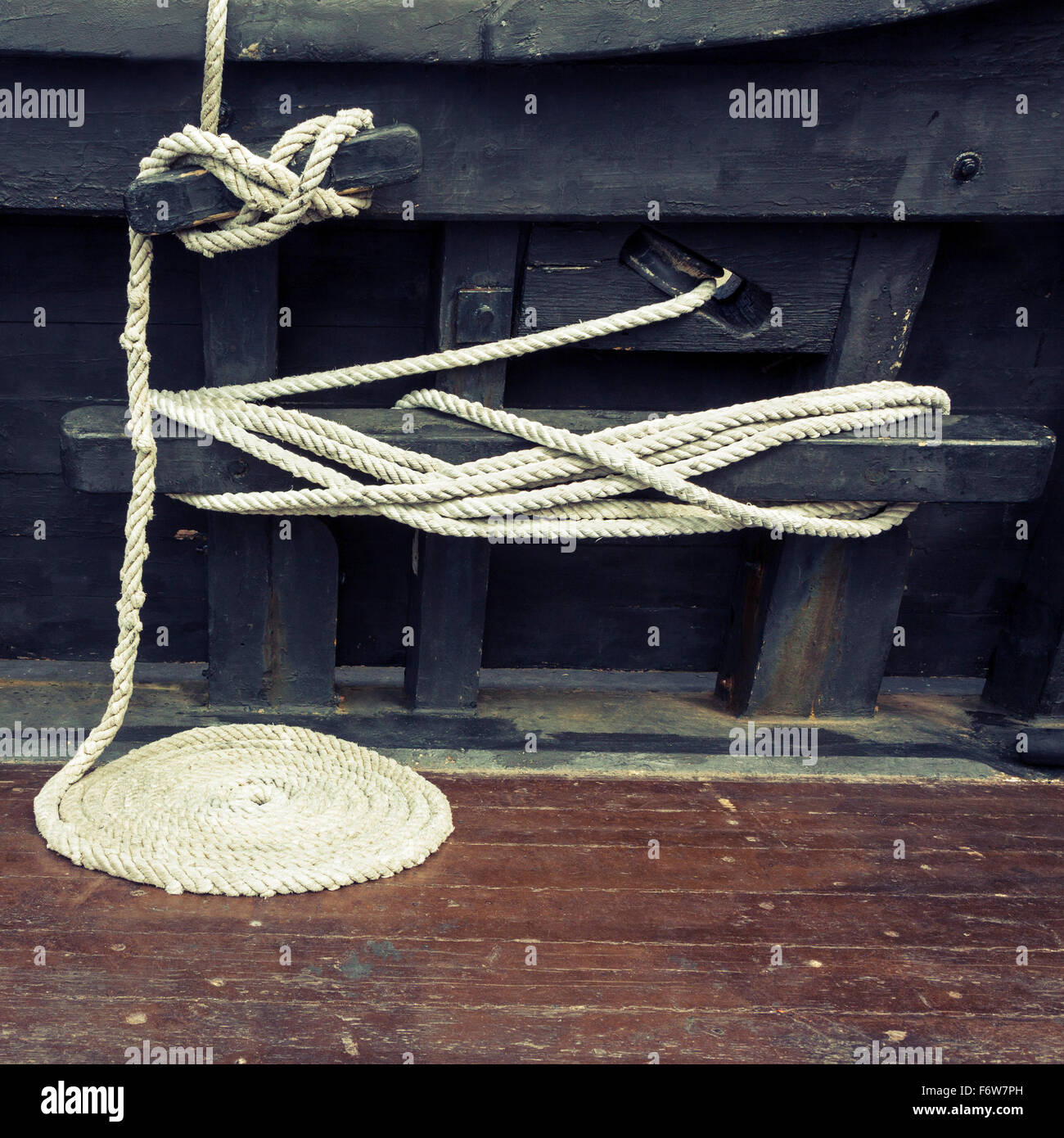 Coiled maritime rope on wooden deck of an old yacht Stock Photo - Alamy