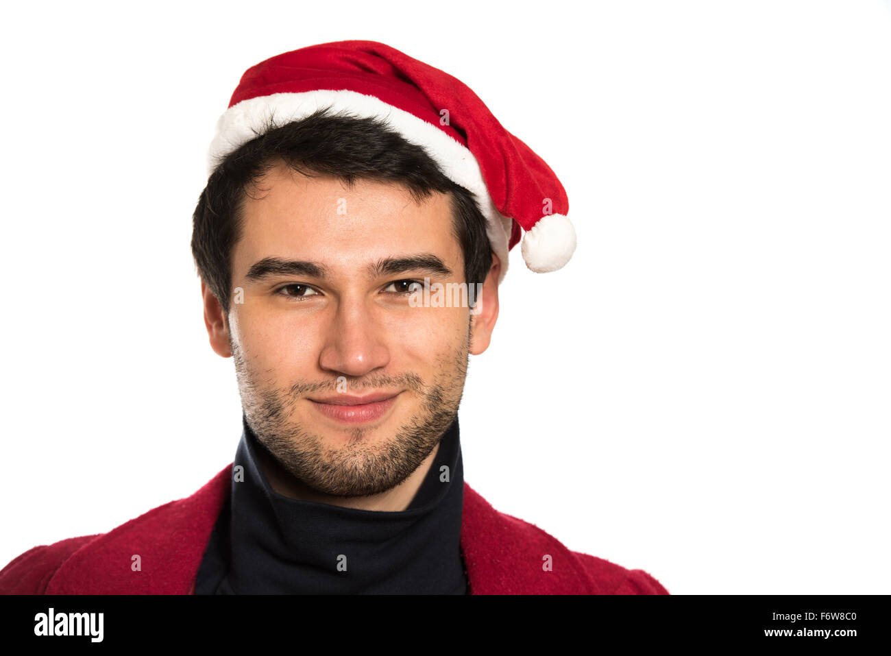 Young handsome brunette man wearing red hut, coat and black pullover ...