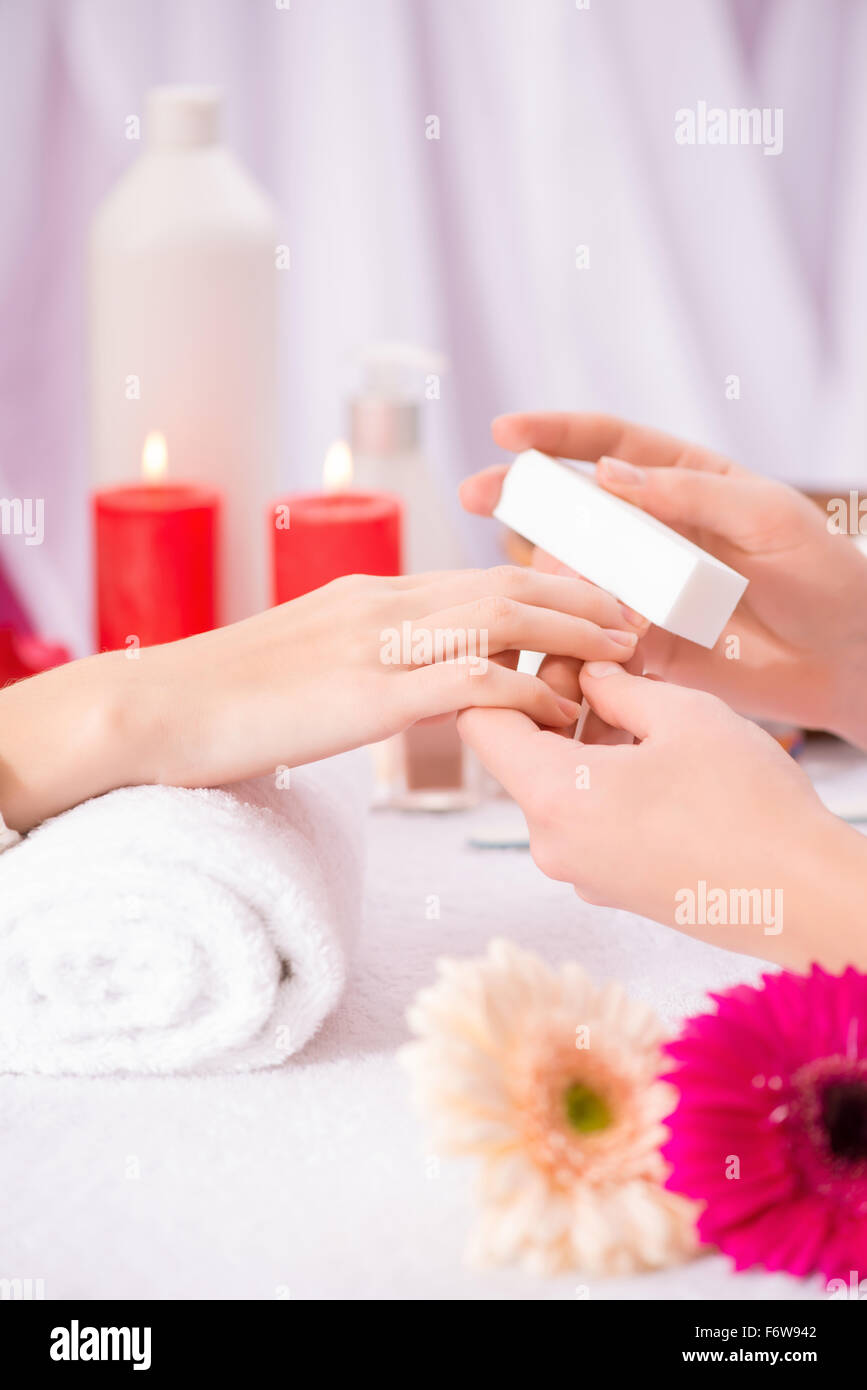 Professional manicurist making manicure Stock Photo - Alamy
