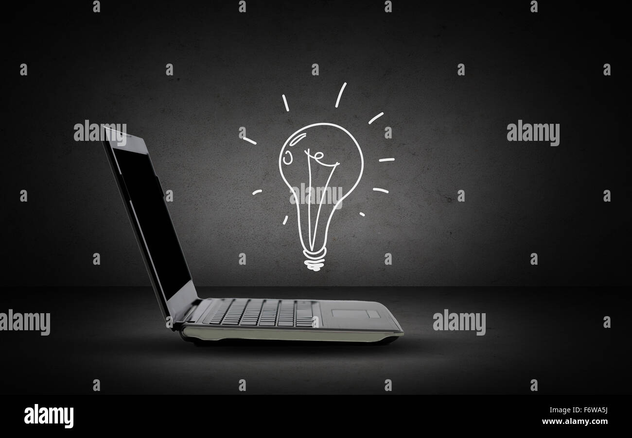open laptop computer with lighting bulb doodle Stock Photo - Alamy