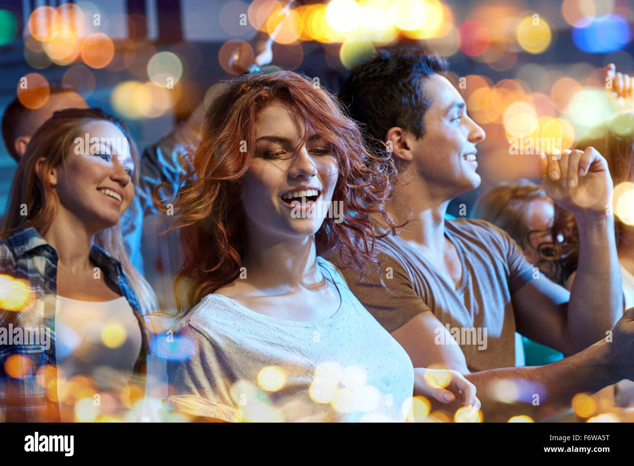 happy friends dancing at night club Stock Photo - Alamy