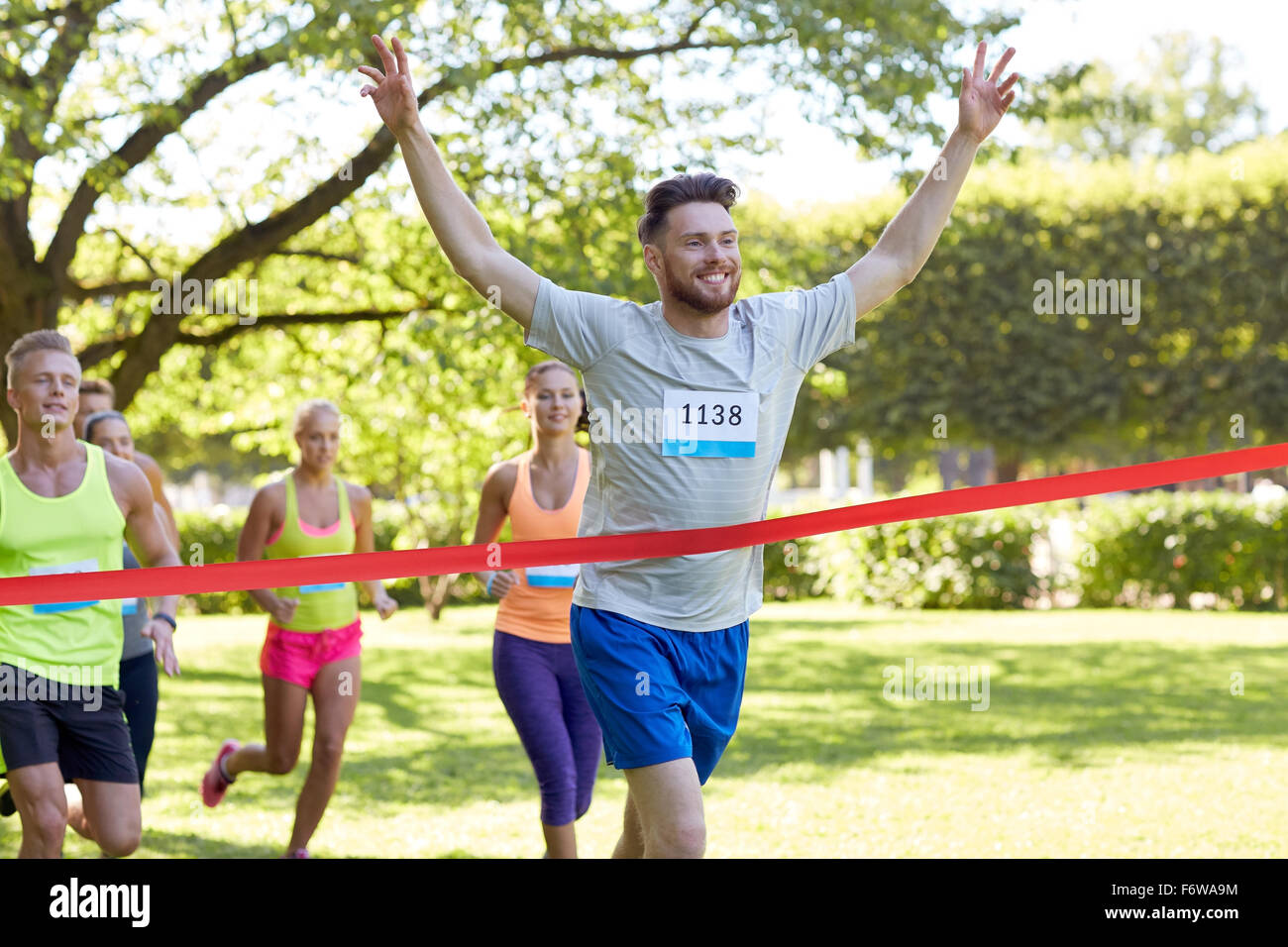 happy young male runner winning on race finish Stock Photo - Alamy