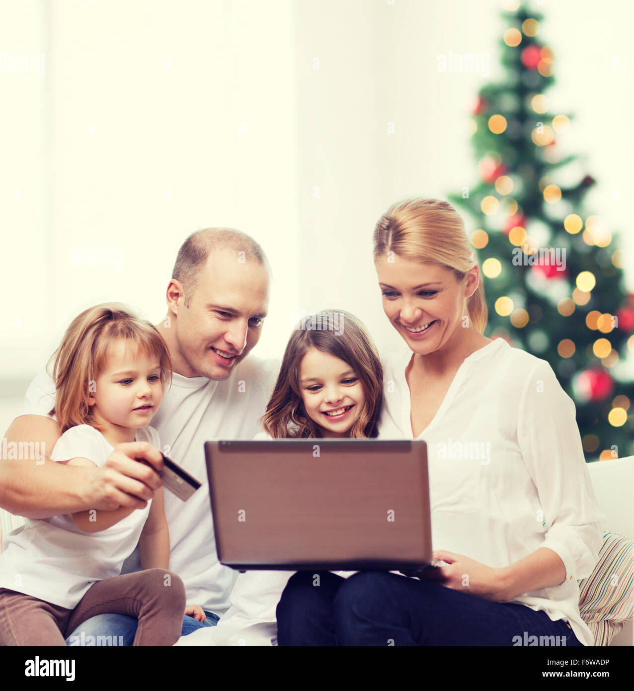 happy family with laptop computer Stock Photo - Alamy