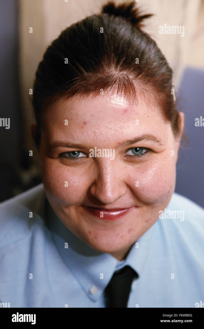 Portrait of a young woman with learning disabilities in a uniform Stock ...