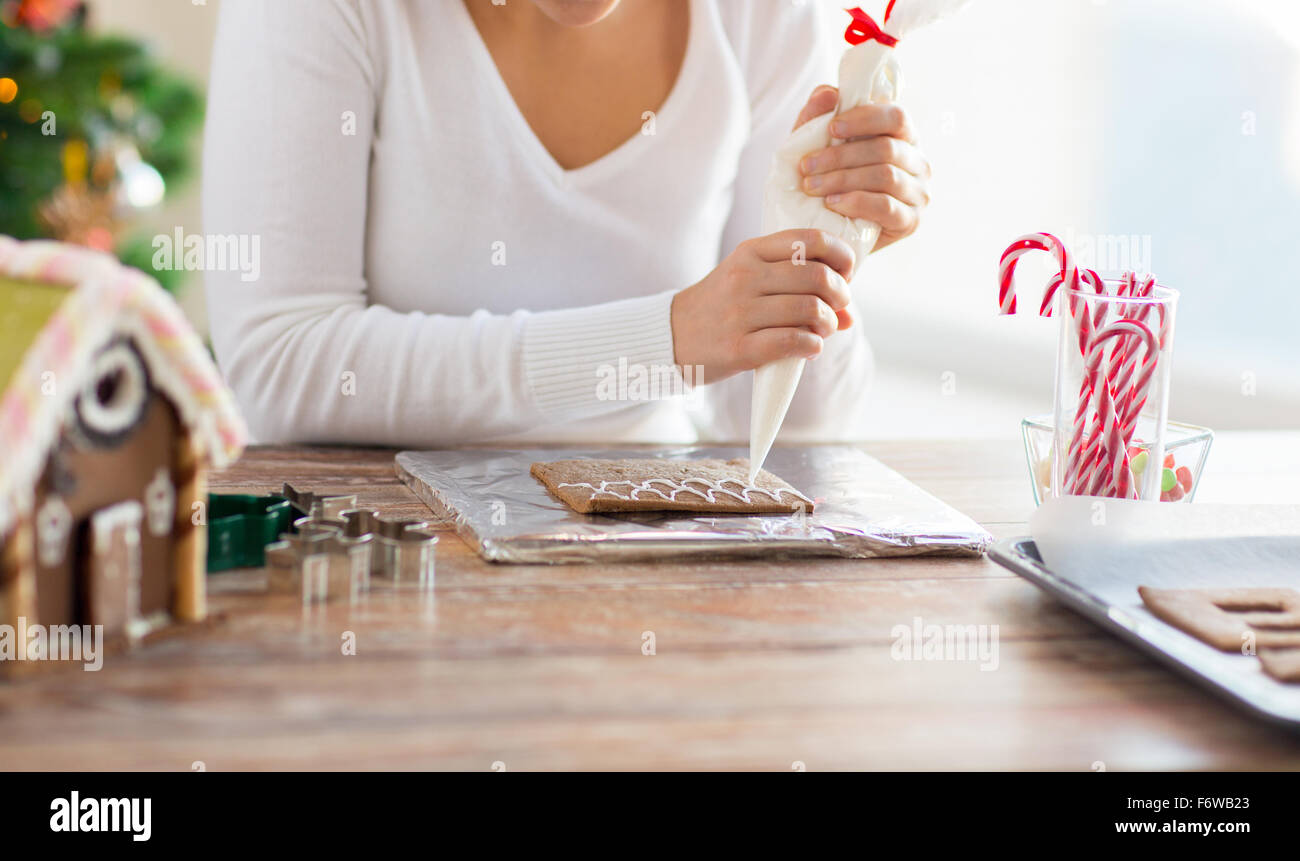 close up of woman making gingerbread houses Stock Photo - Alamy