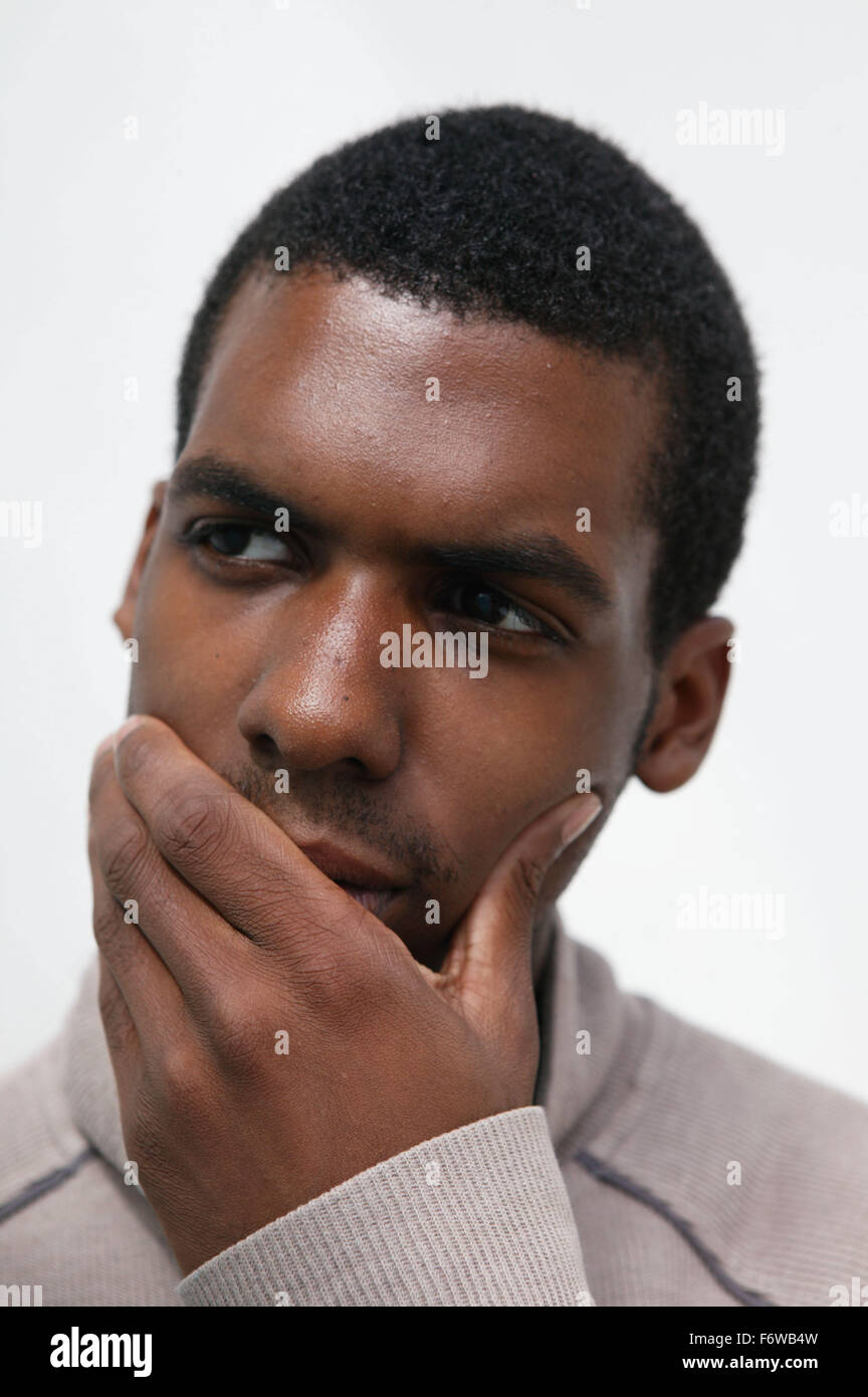 Portrait of puzzled looking youth Stock Photo - Alamy