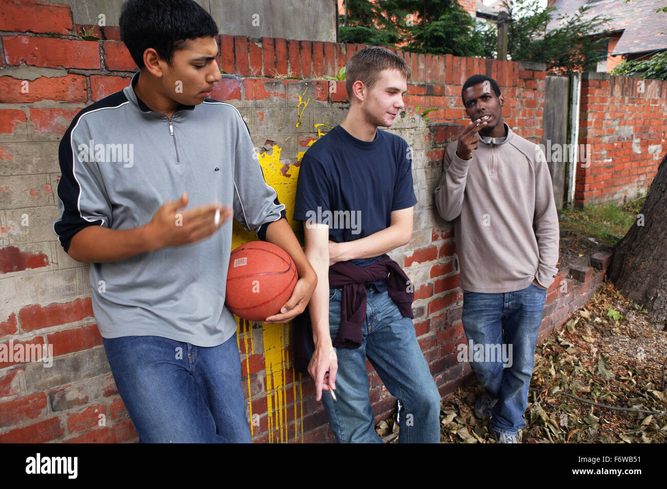 Black men loitering hi-res stock photography and images - Alamy