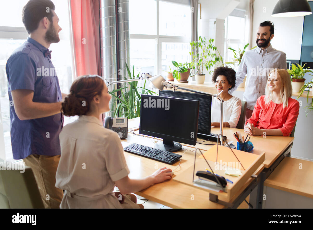 Creative team friends talking hi-res stock photography and images - Alamy