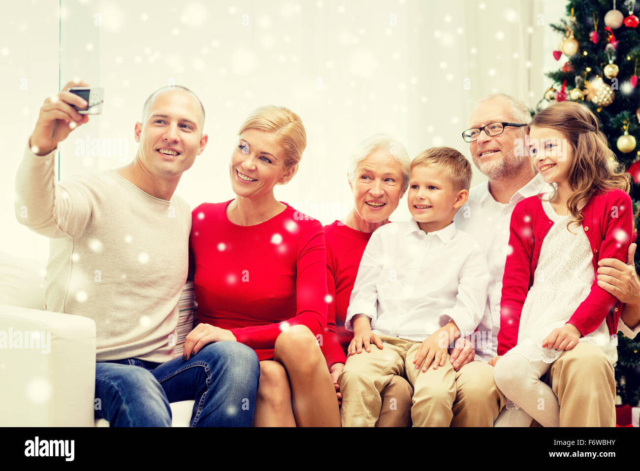 smiling family with camera at home Stock Photo - Alamy
