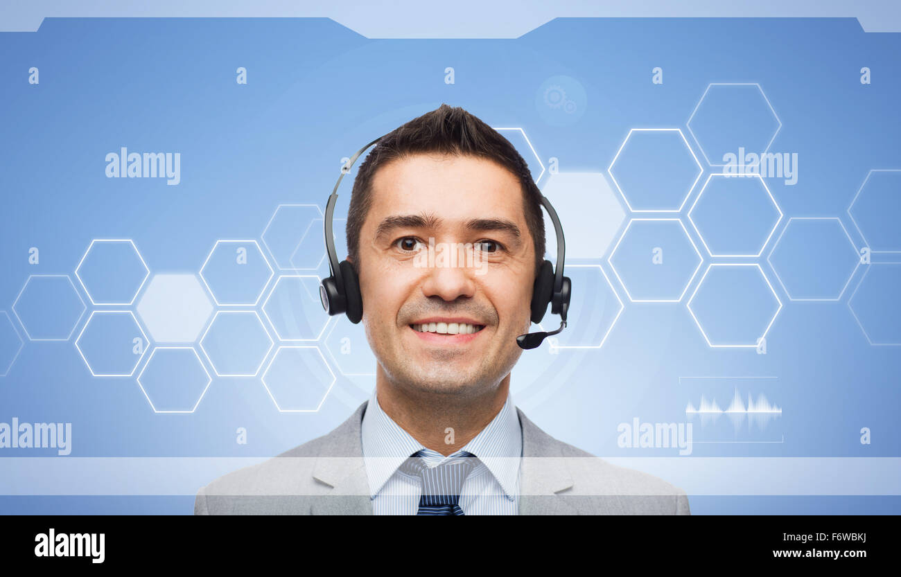 smiling businessman in headset over virtual screen Stock Photo - Alamy