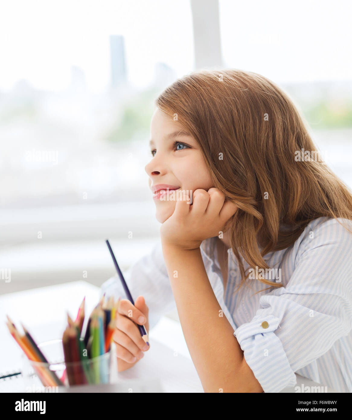 little student girl drawing and dreaming at school Stock Photo - Alamy