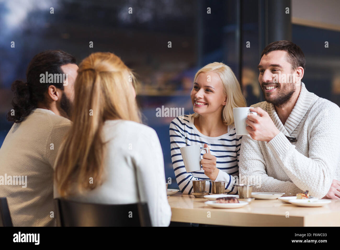 happy friends meeting and drinking tea or coffee Stock Photo - Alamy