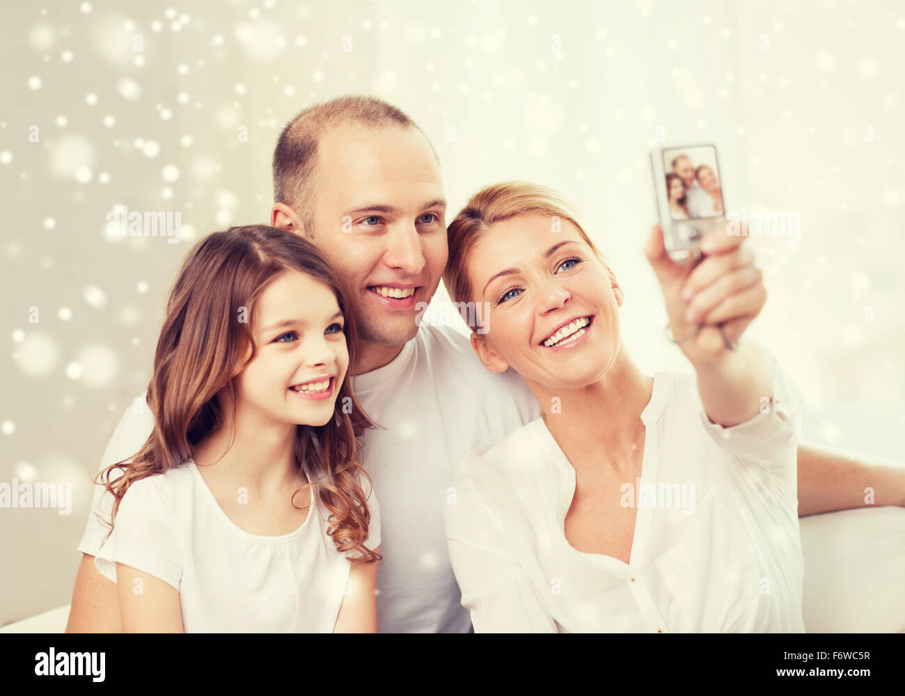 happy family with camera taking picture at home Stock Photo - Alamy