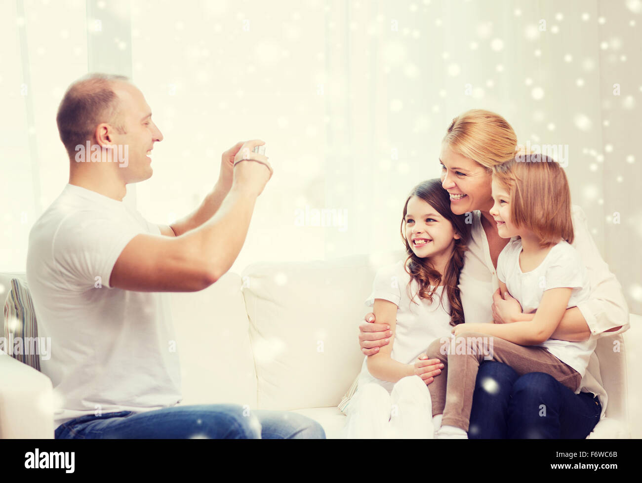 happy family with camera taking picture at home Stock Photo - Alamy