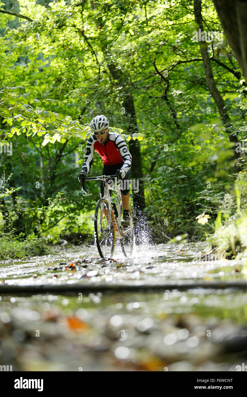 Man cyclocross touring in autumn, Oberambach, Munsing, Bavaria, Germany ...