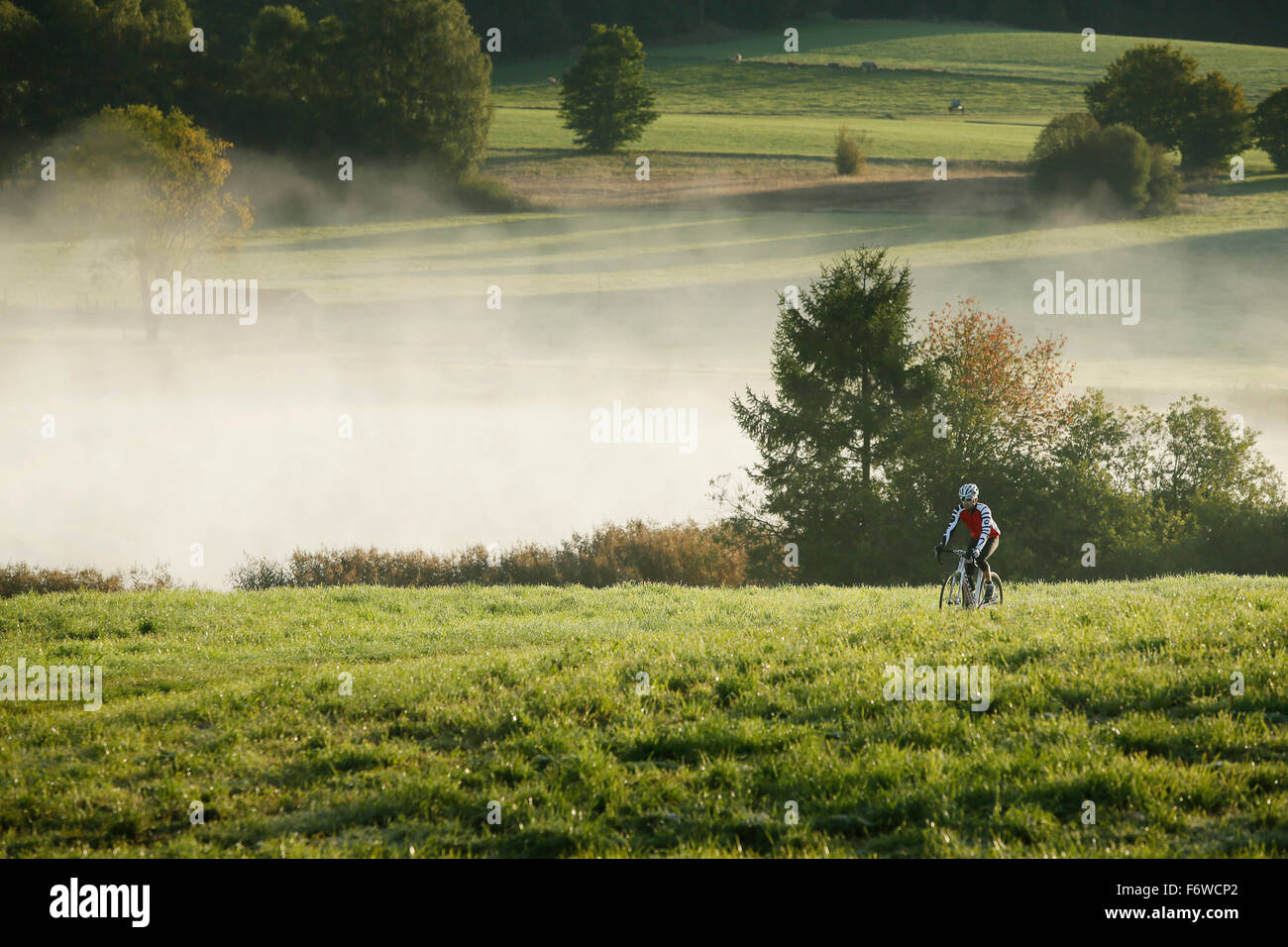 Man cyclocross touring in autumn, Degerndorf, Munsing, Bavaria, Germany ...