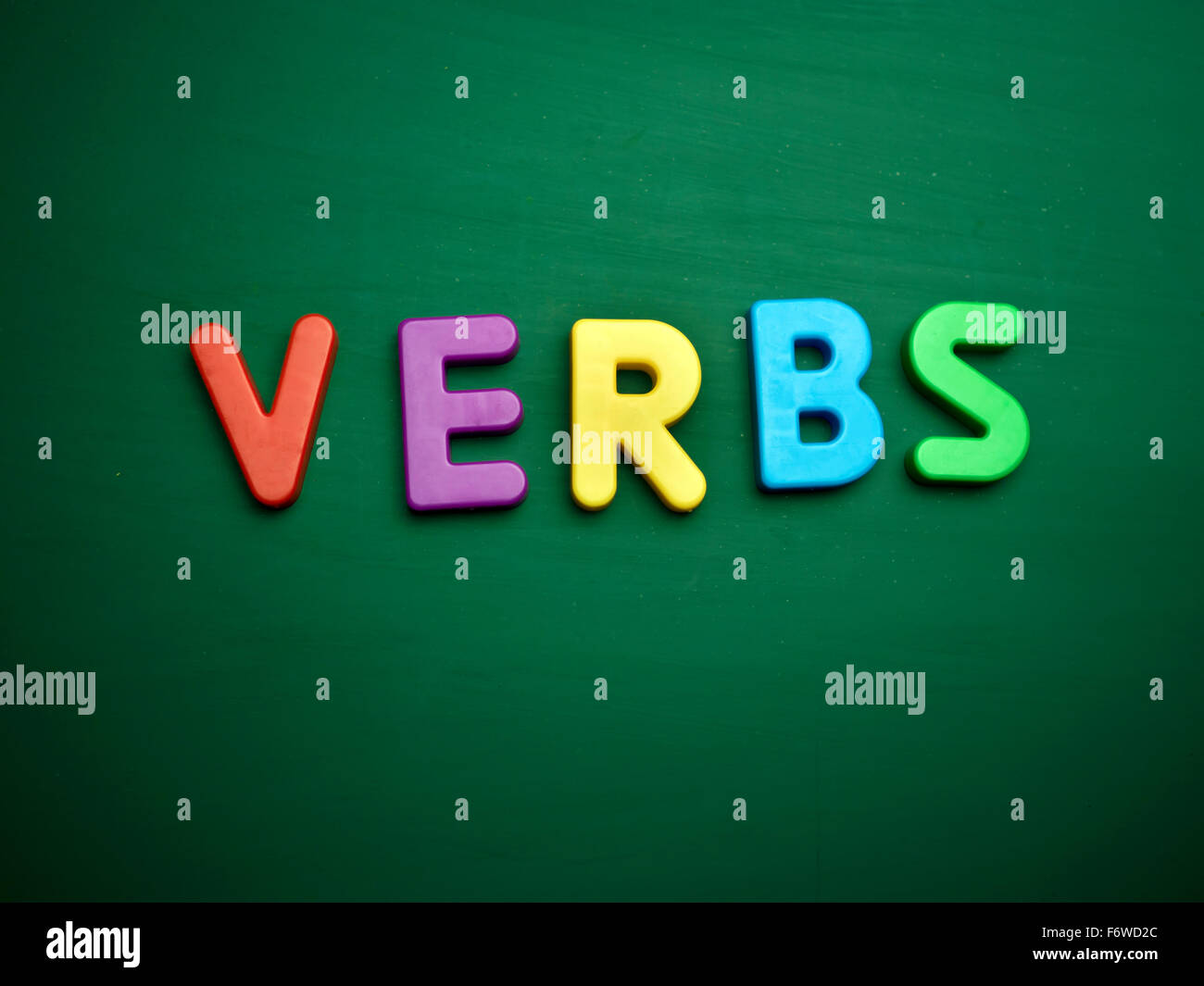 verbs concept in colorful letters isolated on blank blackboard Stock ...