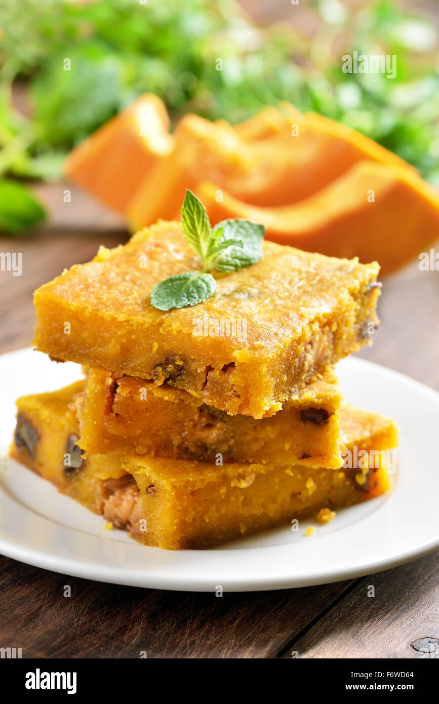 Pumpkin bars with nuts on wooden table Stock Photo - Alamy