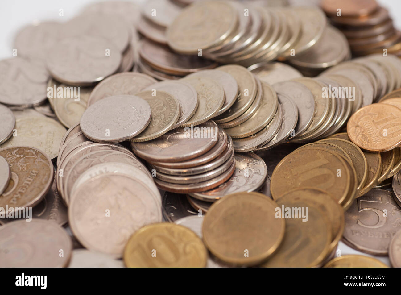 Stack of coins isolated on white Stock Photo - Alamy