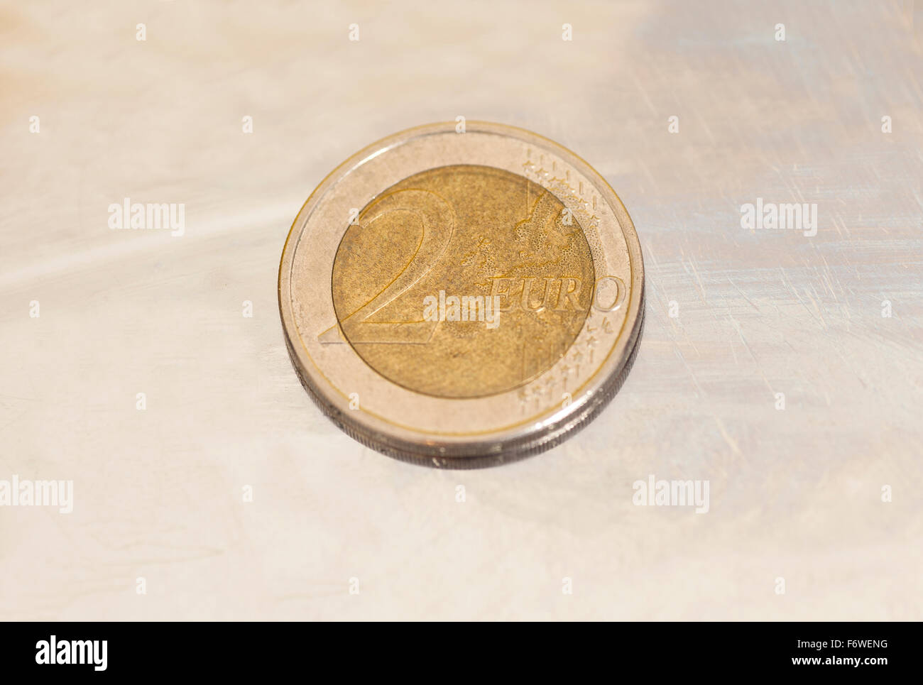 two euro coin closeup on metal background Stock Photo - Alamy