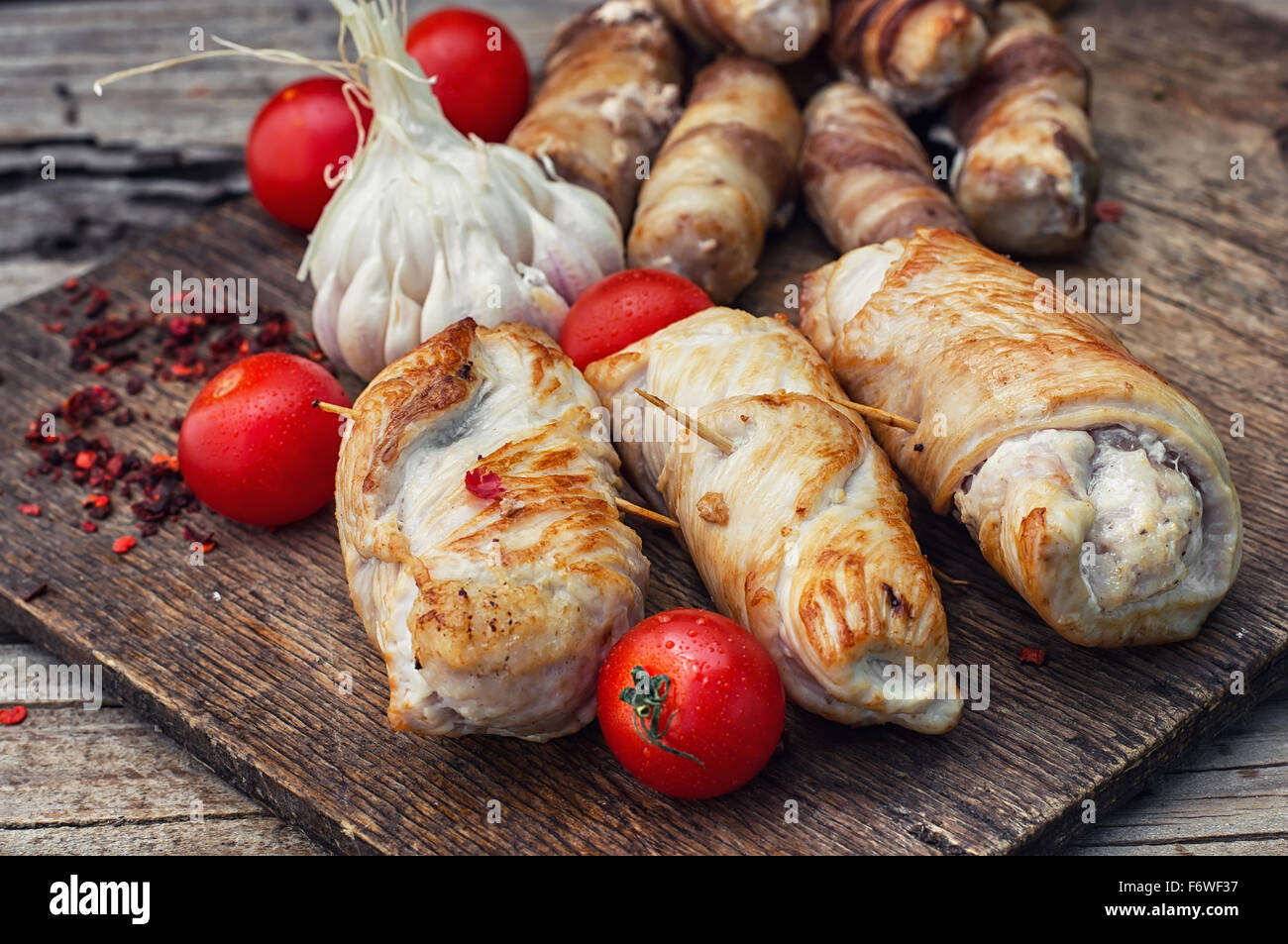 Set of rolled into tube of sausage meat in rustic style Stock Photo - Alamy